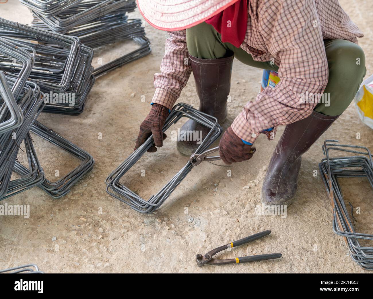 A construction worker wire steel frame of reinforced concreate ...