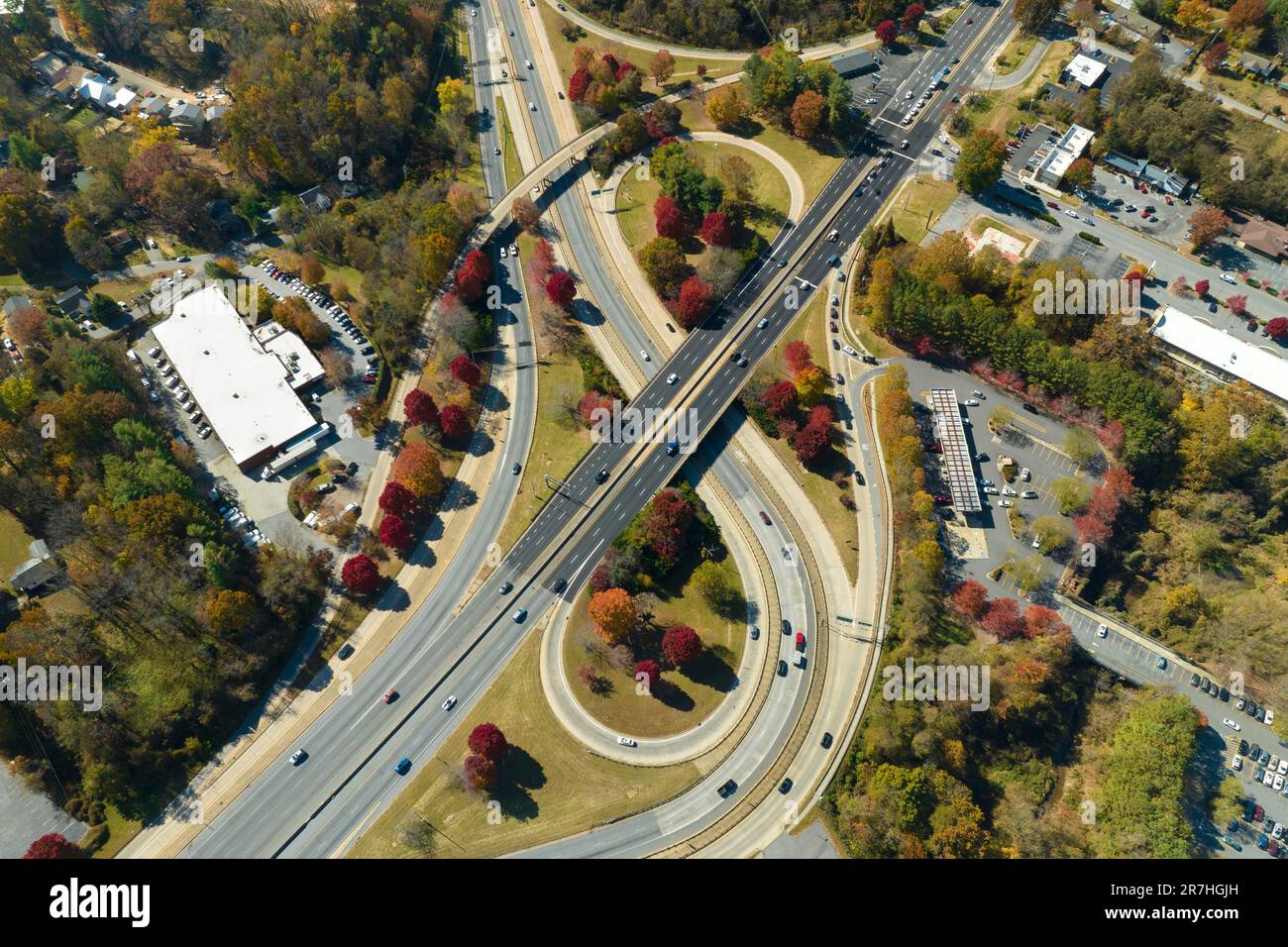 Aerial view of american freeway intersection with fast moving cars and ...