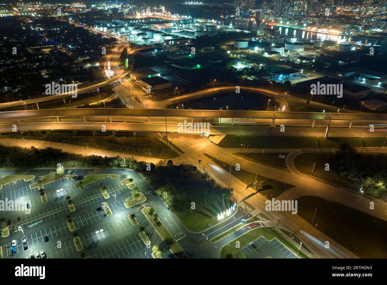 Aerial view of american highway junction at night with fast driving ...