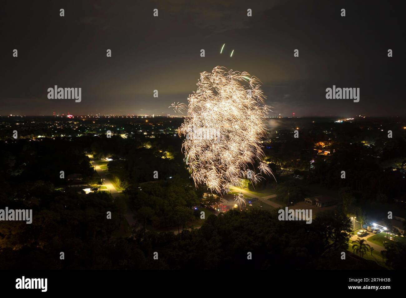 Aerial view of bright fireworks exploding with colorful lights over ...