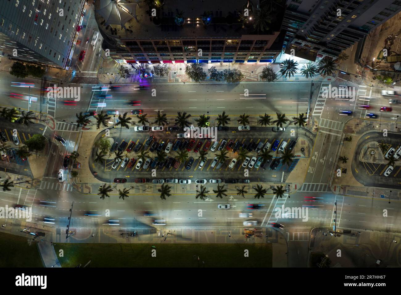Aerial view of brightly illuminated street in downtown district of ...