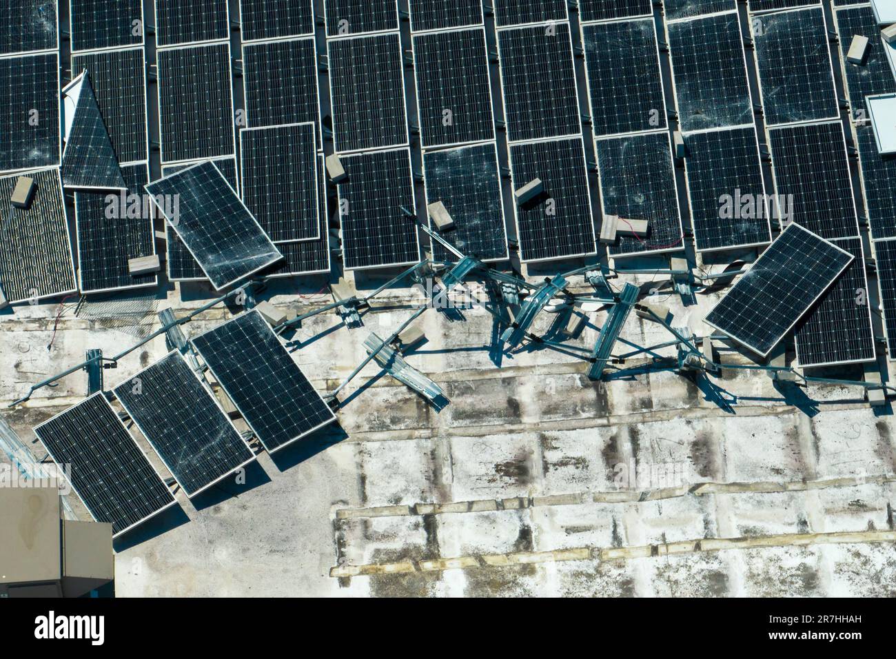 Aerial view of damaged by hurricane wind photovoltaic solar panels ...