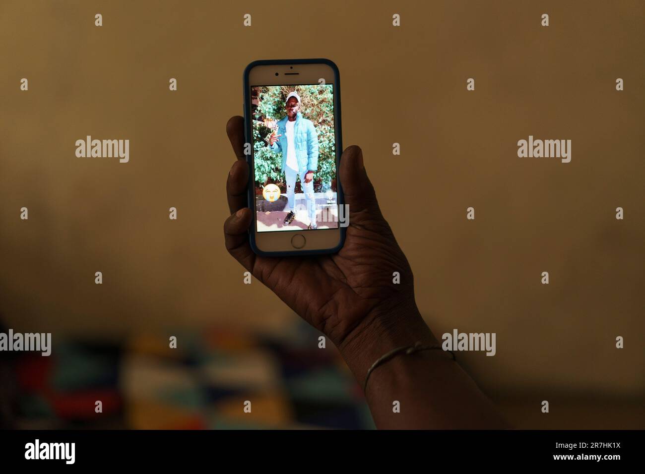 Ibrahima Ba shows, on a mobile phone, a picture of his son Khadim Ba ...