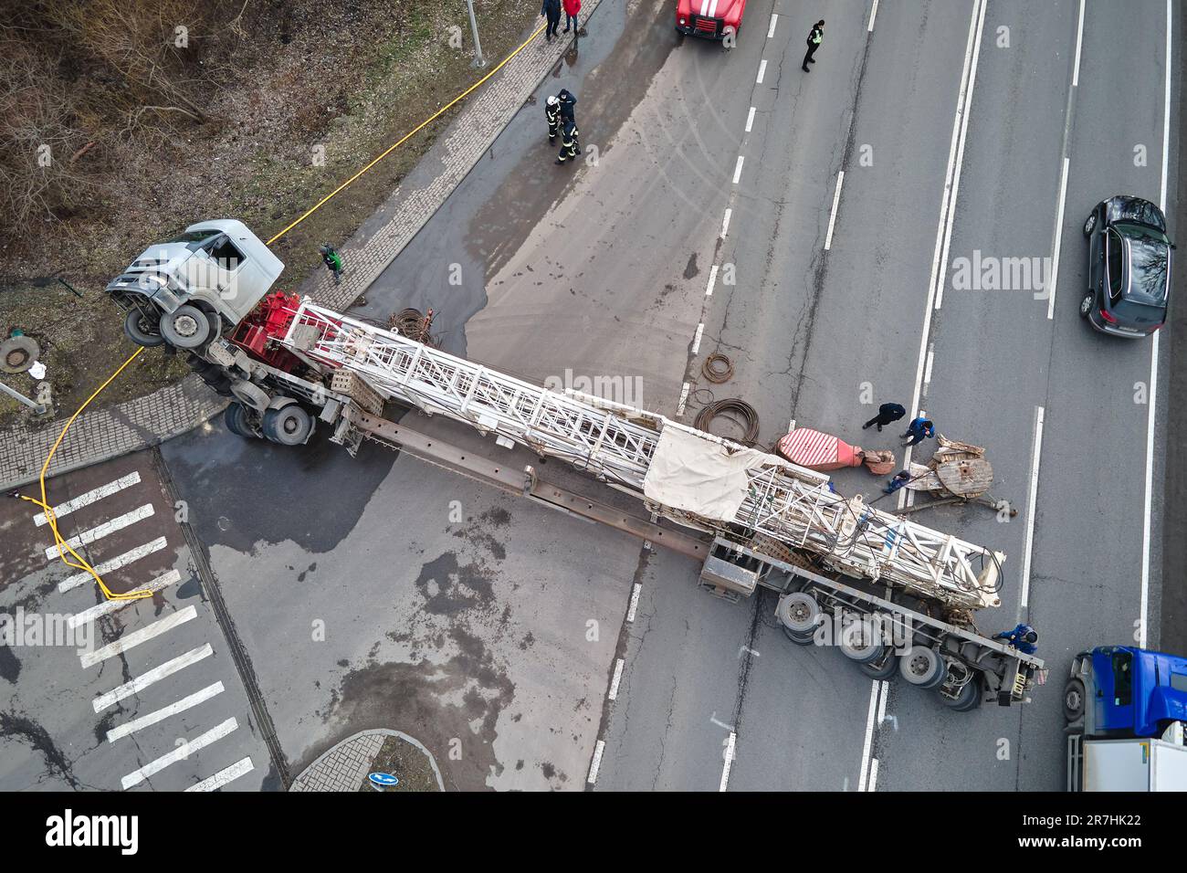 Aerial view of road accident with overturned truck blocking traffic ...
