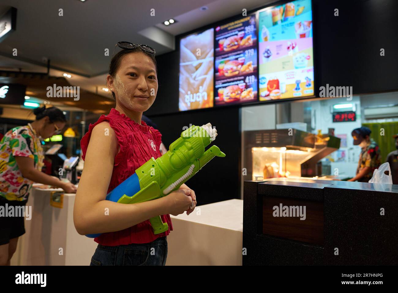 PATTAYA, THAILAND - CIRCA APRIL, 2023: indoor portrait of woman in McDonald's fast food ...