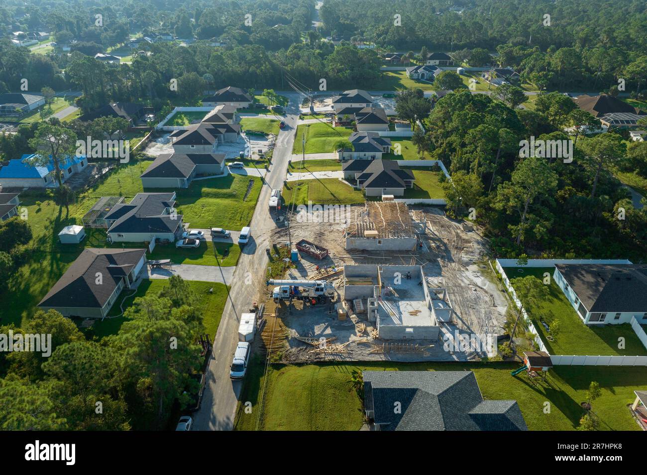 Professional builders working on roof construction of unfinished ...