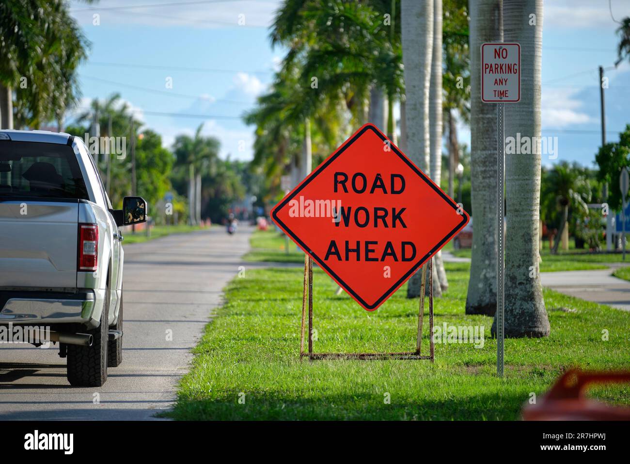 Road work ahead sign on street site as warning to cars about ...