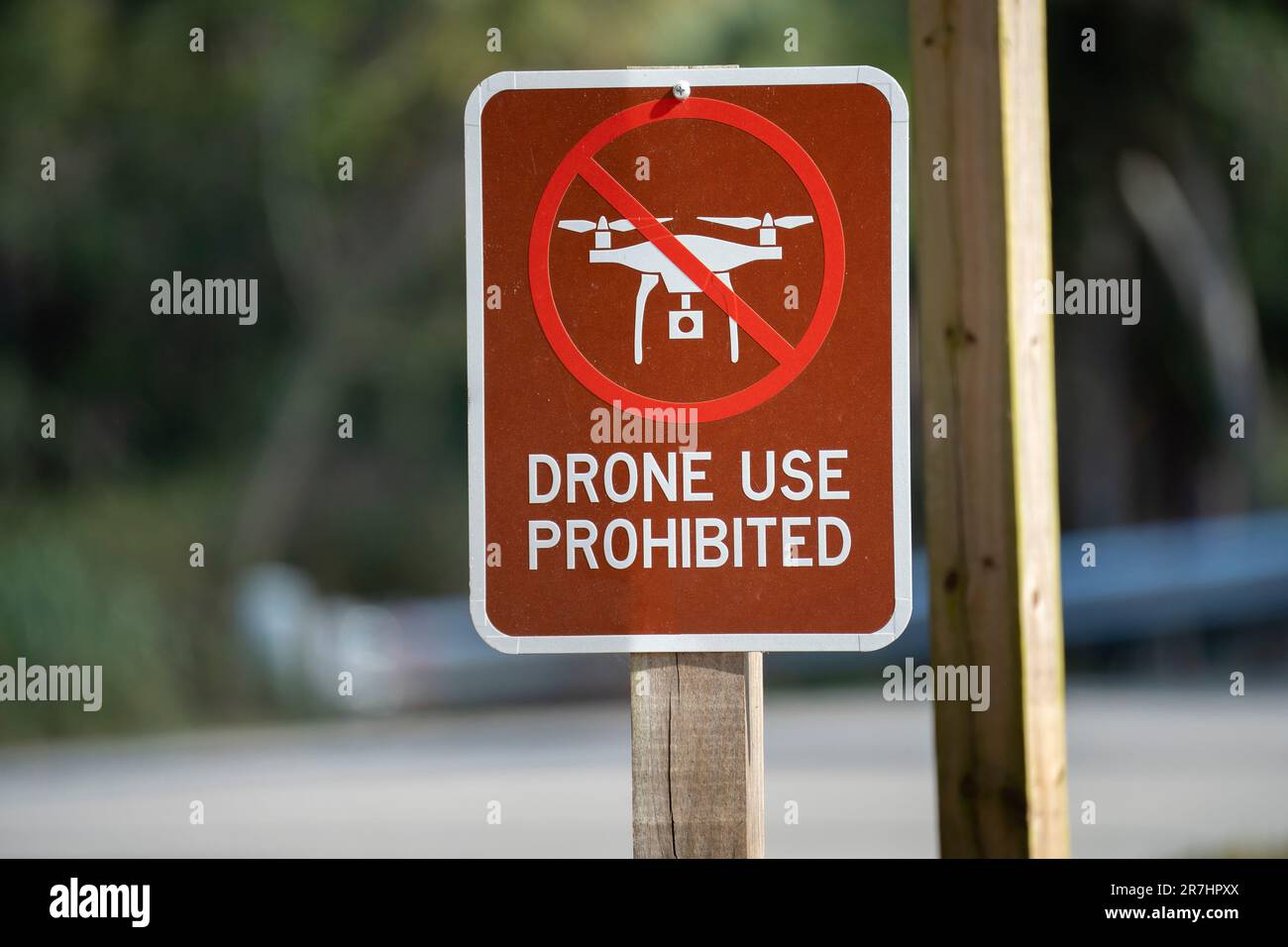 Signpost with warning about drone usage prohibition in state park ...