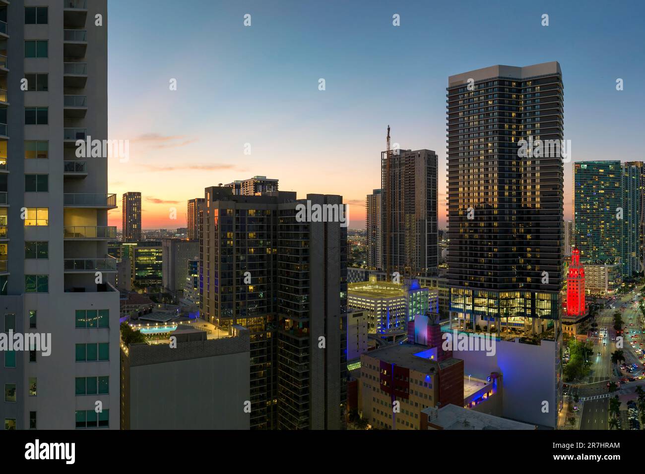 View from above of brightly illuminated skyscraper buildings in ...