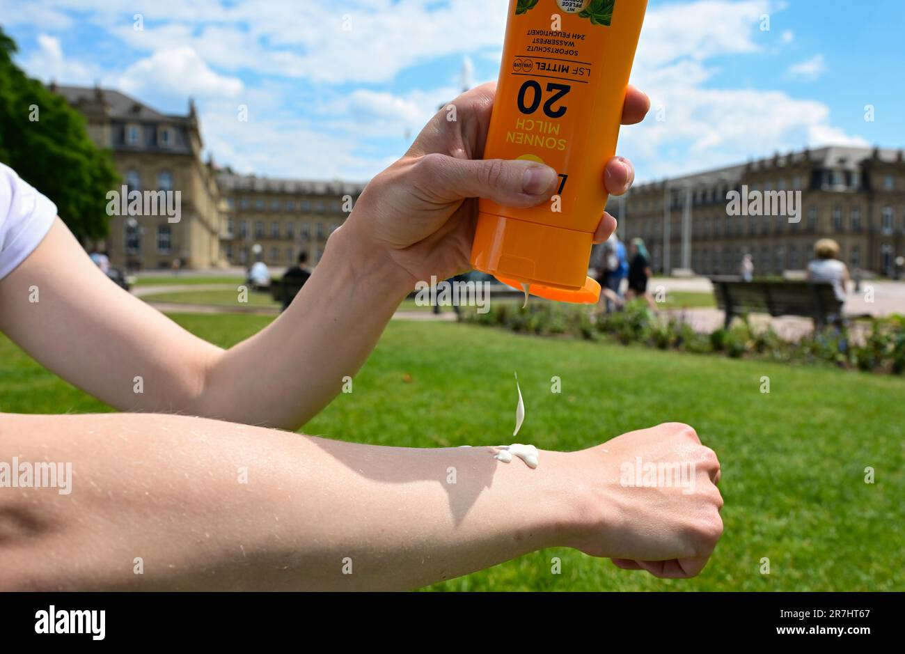 Stuttgart, Germany. 15th June, 2023. A woman applies sunscreen on the ...