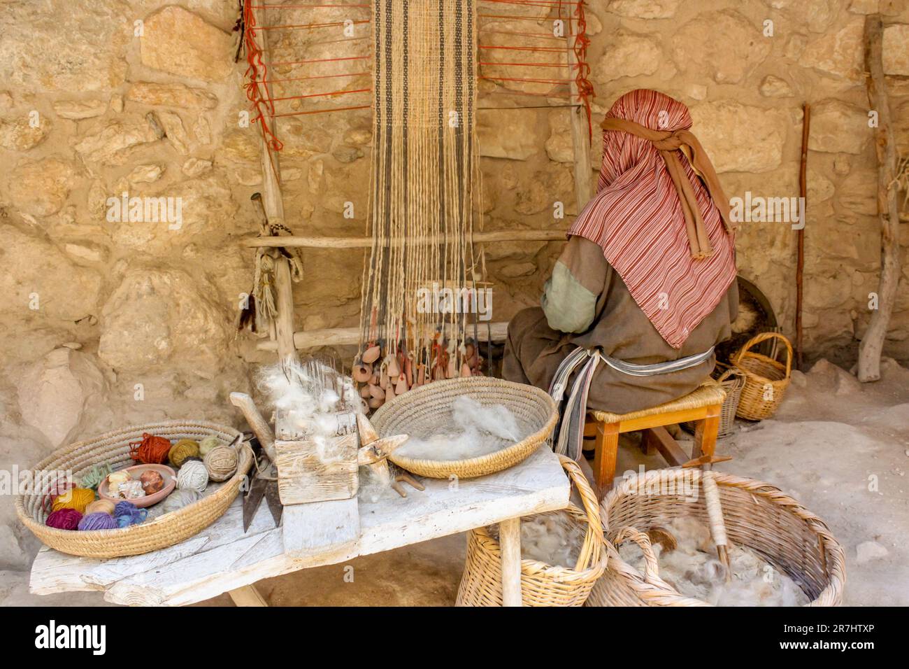 Hannah the Weather works with her loom at the Nazareth Village open-air ...