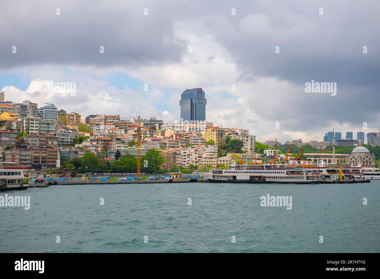 Ferry ship at Kabatas port and historic waterfront building with Suzer ...