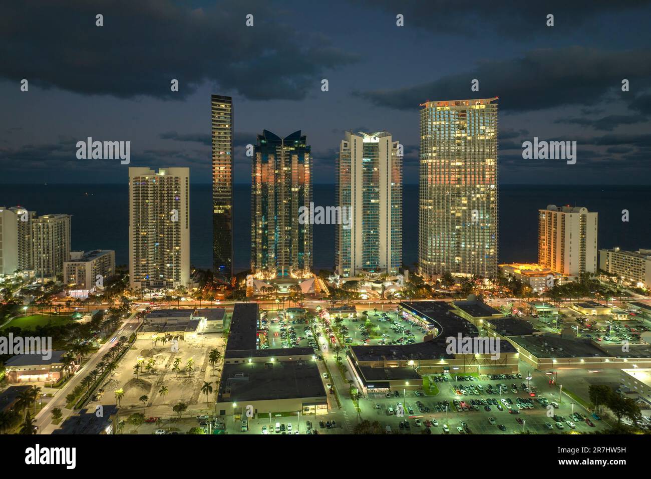View from above of brightly illuminated high skyscraper buildings in ...