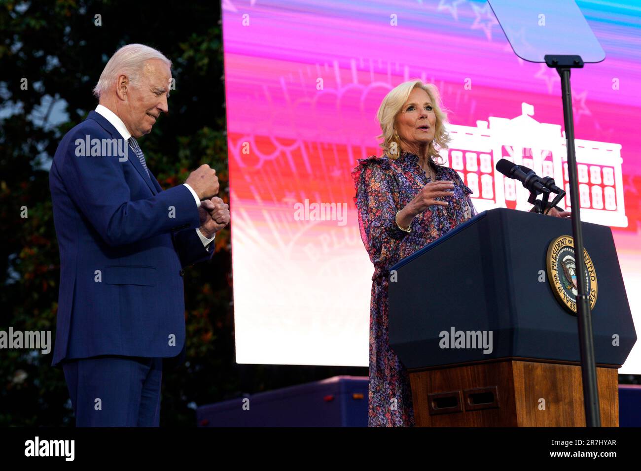 United States President Joe Biden gestures as first lady Dr. Jill Biden ...