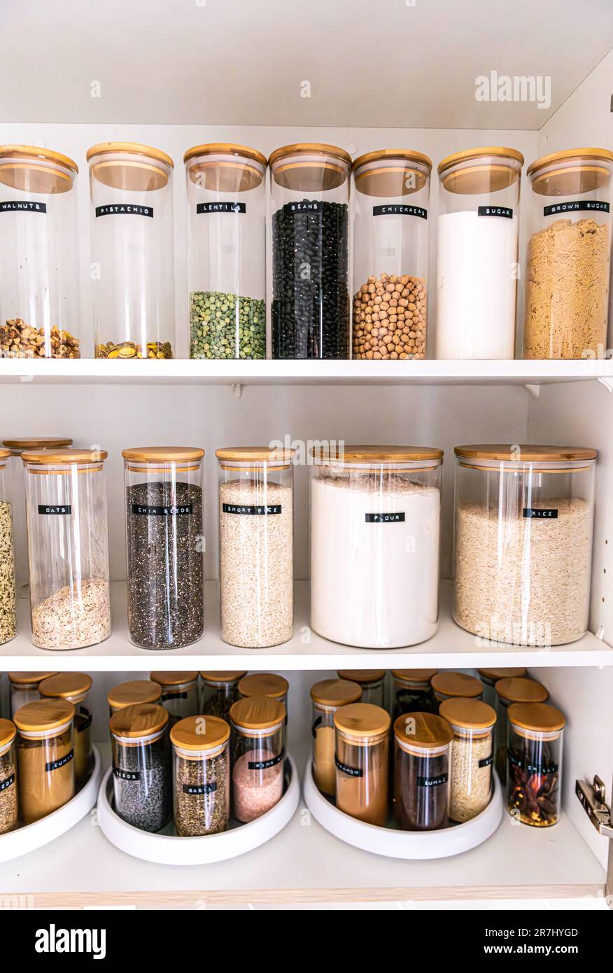 Organized labeled food pantry in a home kitchen with spices Stock Photo ...