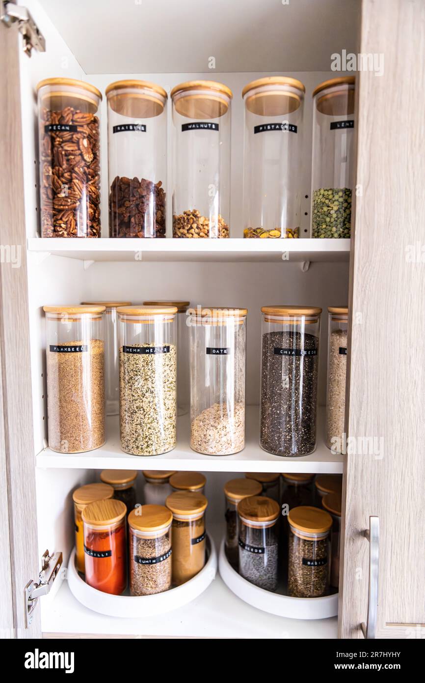 Organized labeled food pantry in a home kitchen with spices Stock Photo - Alamy