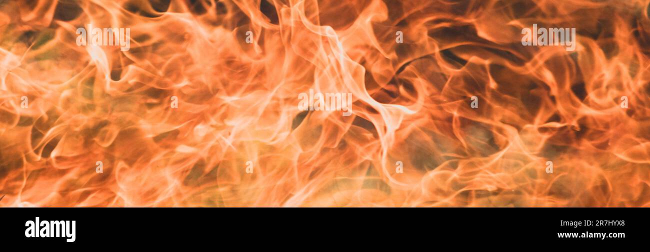 A vibrant, blurred image of a fiery background with bright, glowing ...