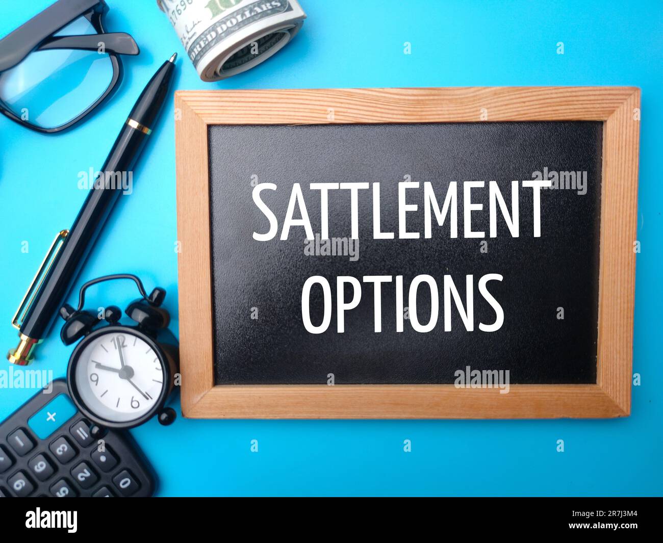 A black chalkboard with white lettering 'Sattlement Options' Stock ...