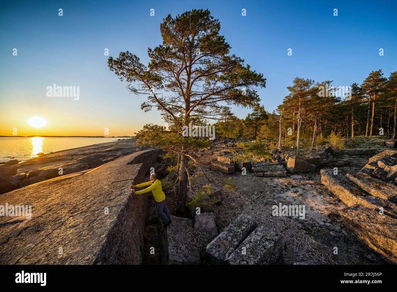 Sunset and and old stone quarry at Pitkä-Kotka island, Hamina, Finland ...