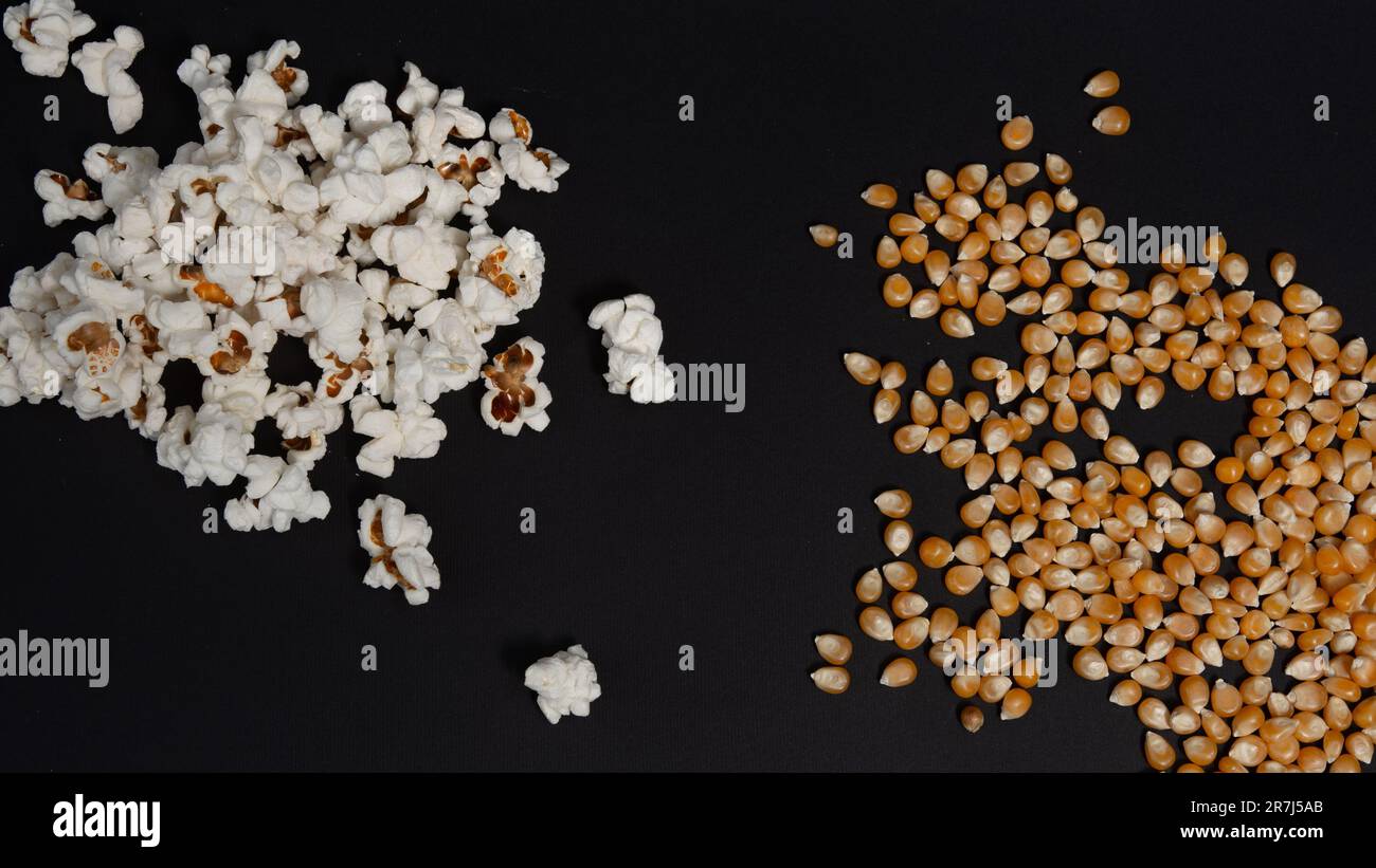 Two piles of popcorn, one pile of ready-made popcorn, another with corn ...