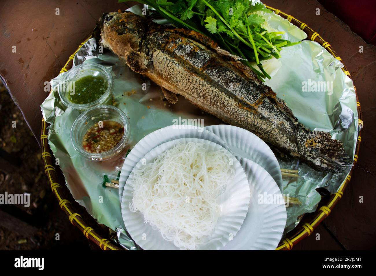 Traditional thai food local gourmet grilled roasted snakehead fish ...