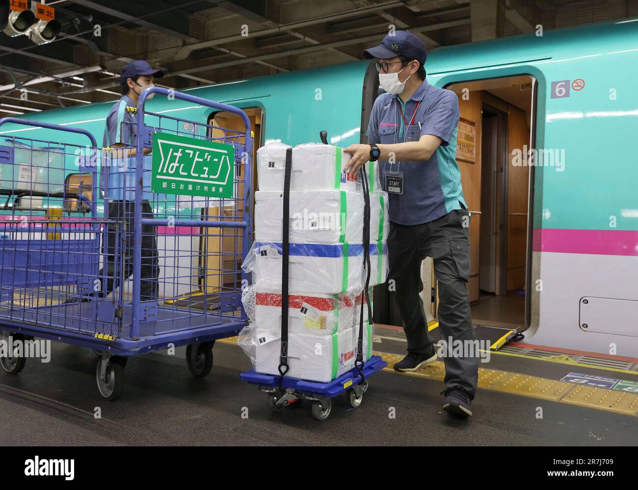 Boxes of fresh foods and others are carried out at Omiya station in ...