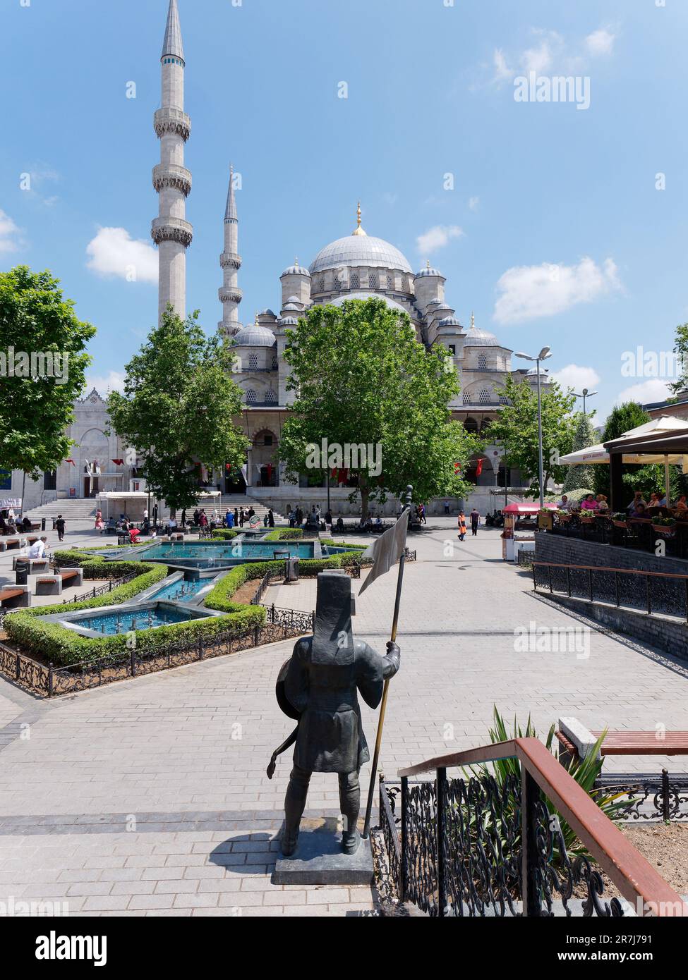 Statue and water feature in a courtyard in front of the Yeni Cami ...