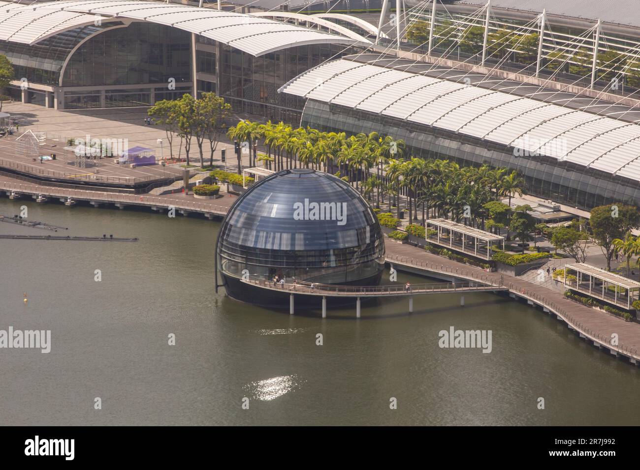 Aerial view of glass dome of Apple Marina Bay Sands, trees planted ...