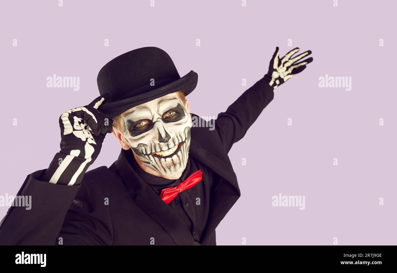 Skeleton man in studio isolated on lilac background Stock Photo - Alamy