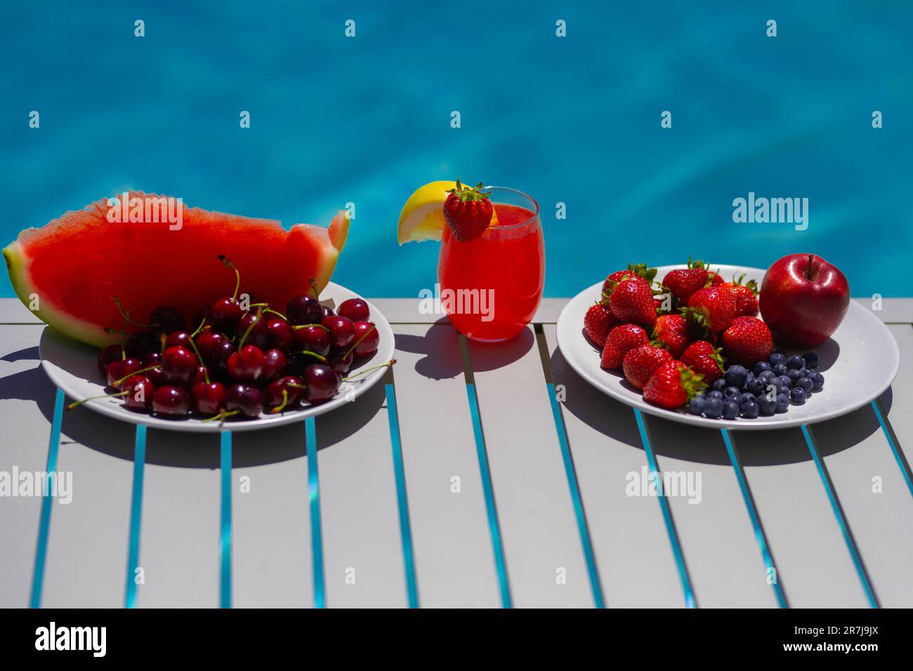 Summer background. Fruit and cocktail on swimming pool background ...