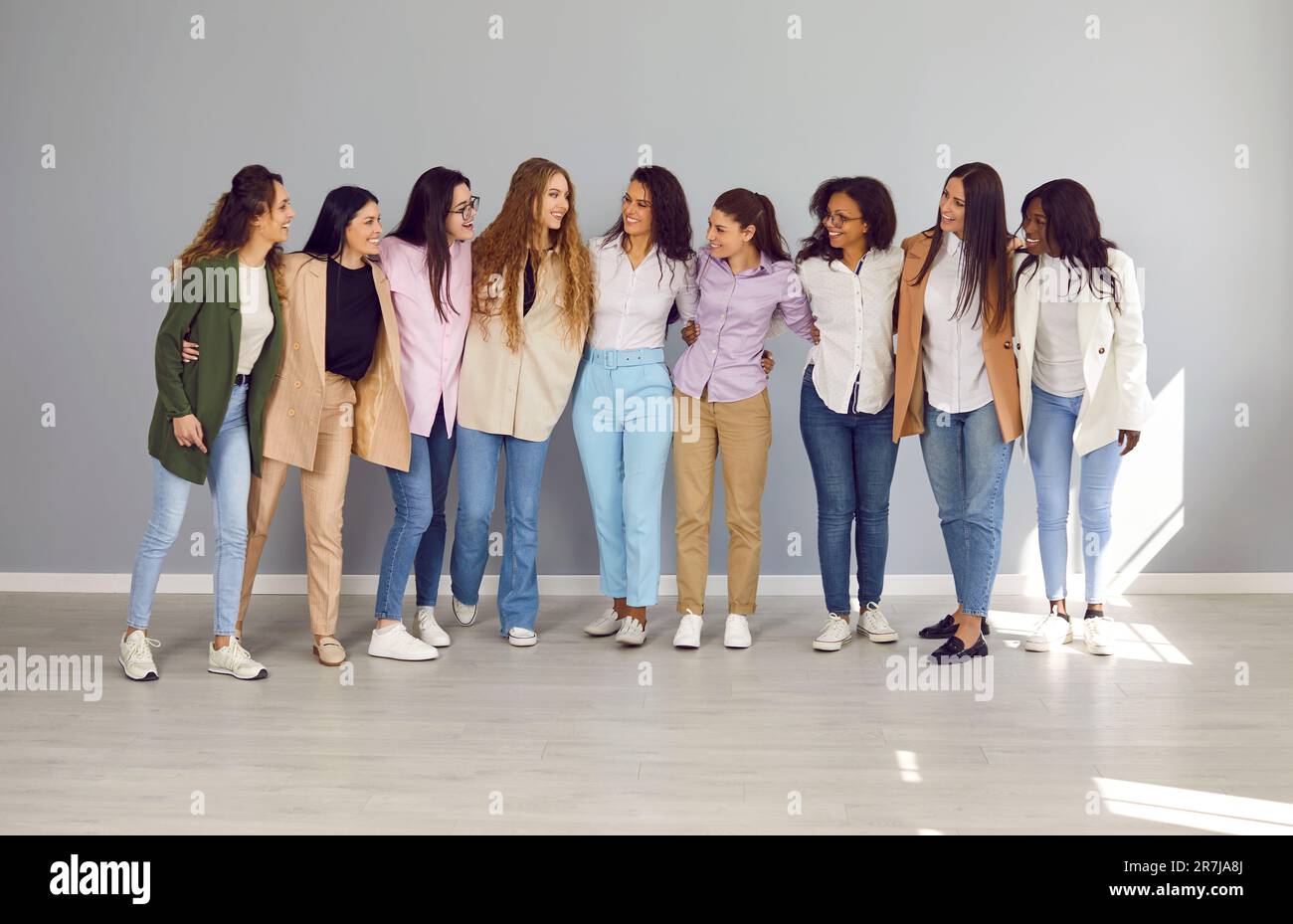 Happy cheerfull young diverse group of women friends or coworkers ...