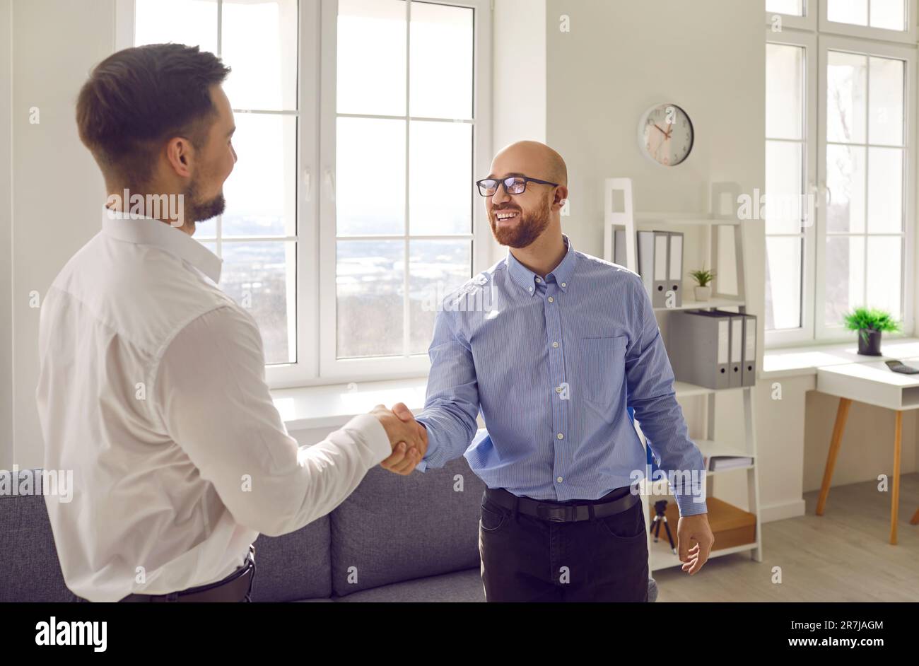 Handshake business partner in modern hi-res stock photography and ...