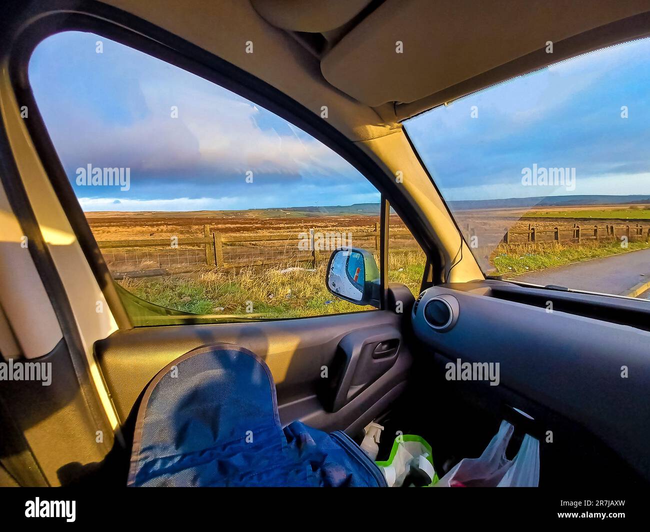 A layby parking area on the outskirts of a city, in the Peak District ...