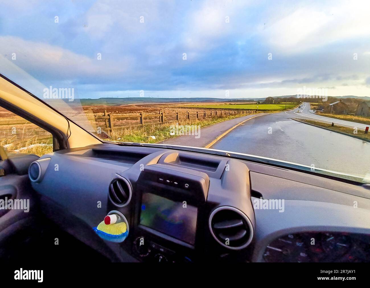 A layby parking area on the outskirts of a city, in the Peak District ...