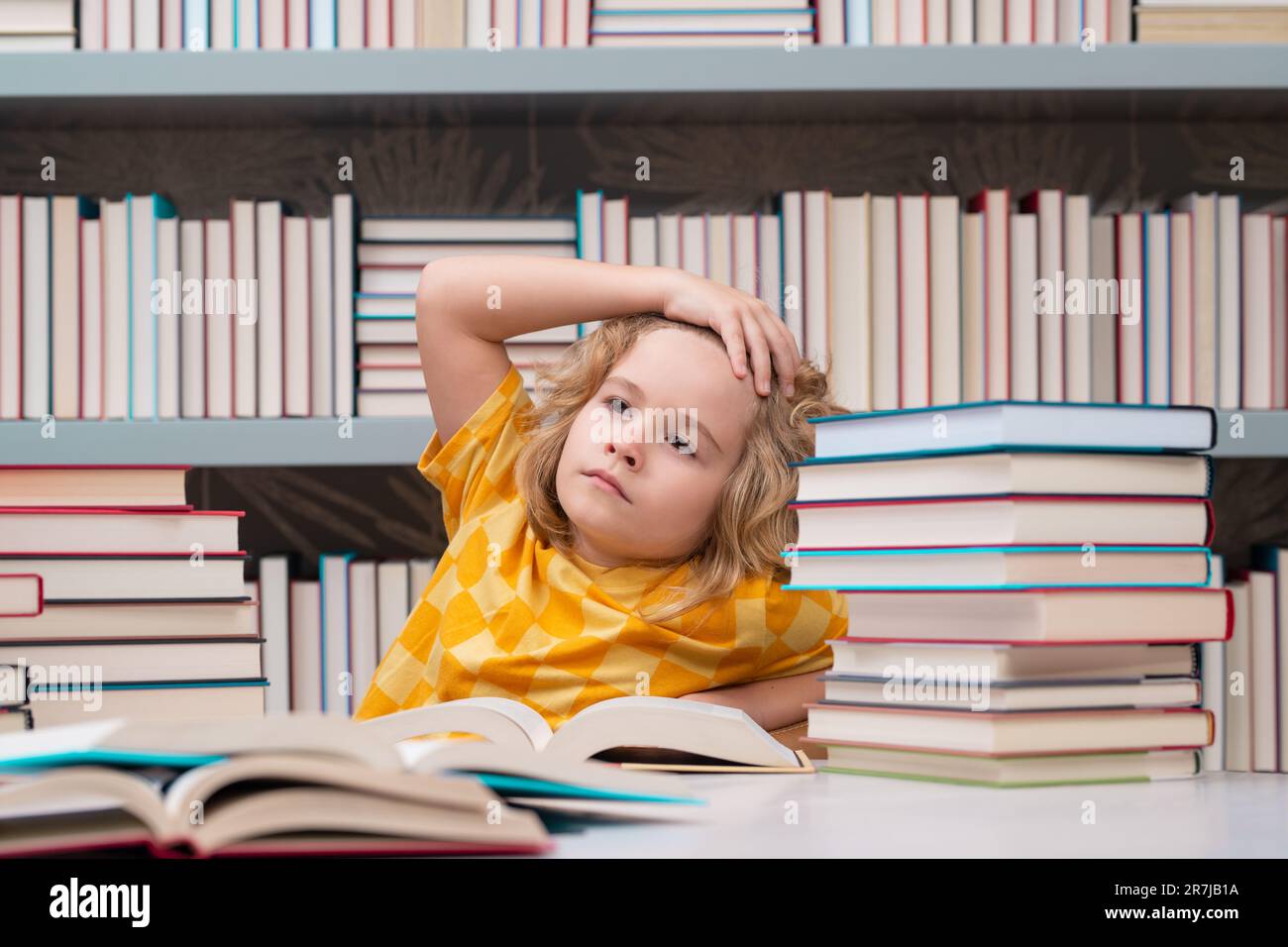 Back to school. Kid on school library. Child reading book at school ...