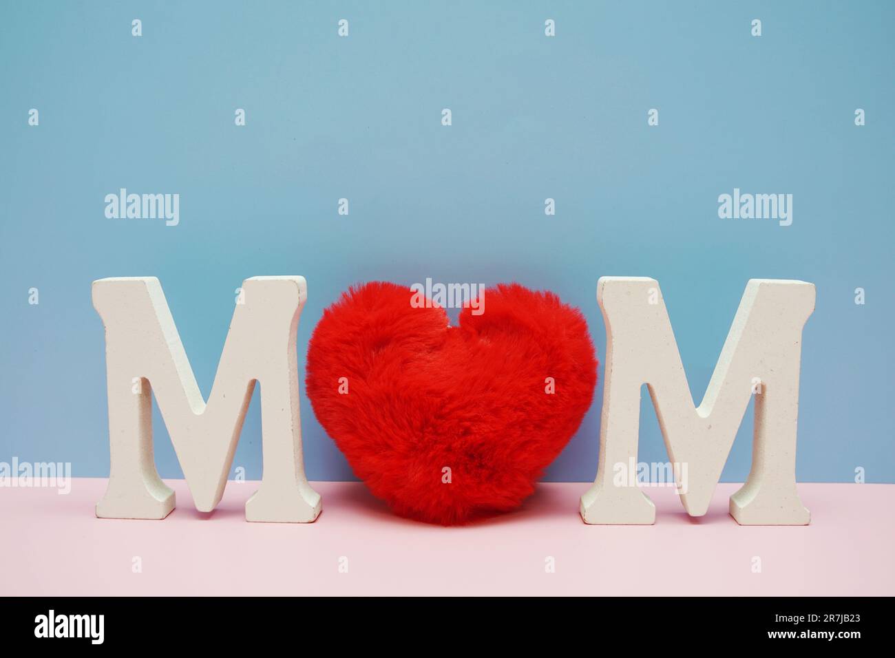 Mother's day background with MOM letters and heart on pink background ...