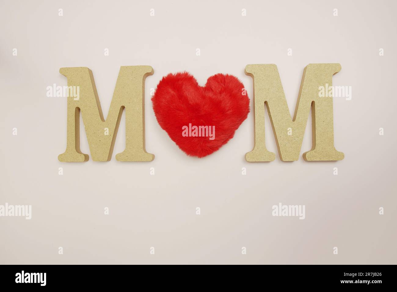 Mom alphabet letter and red heart flat lay on pink background Stock ...
