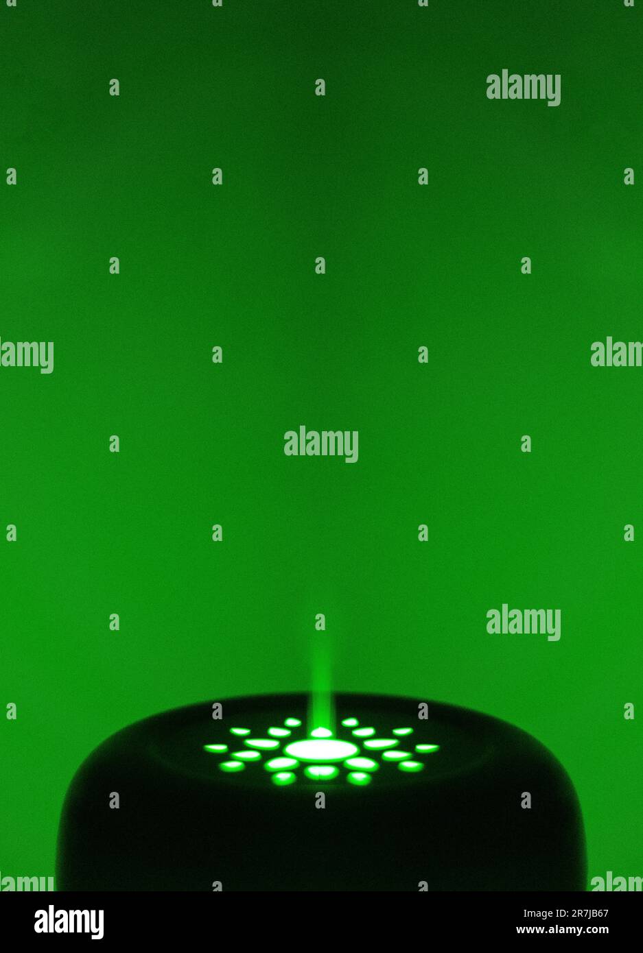 An electronic air humidifier spews scented vapor into the air for ...