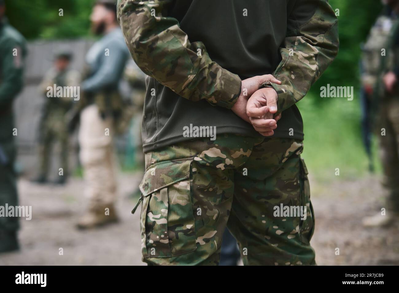 Sergeant training Ukrainian soldiers on a shooting range outdoor. Army ...