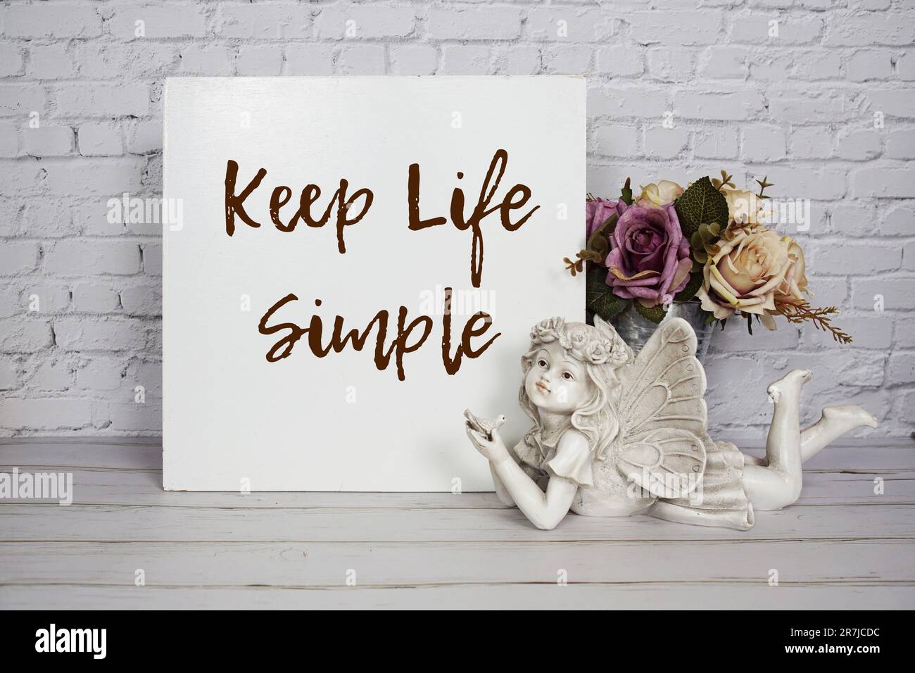 Inspirational quote Keep Life Simple text message written on white ...