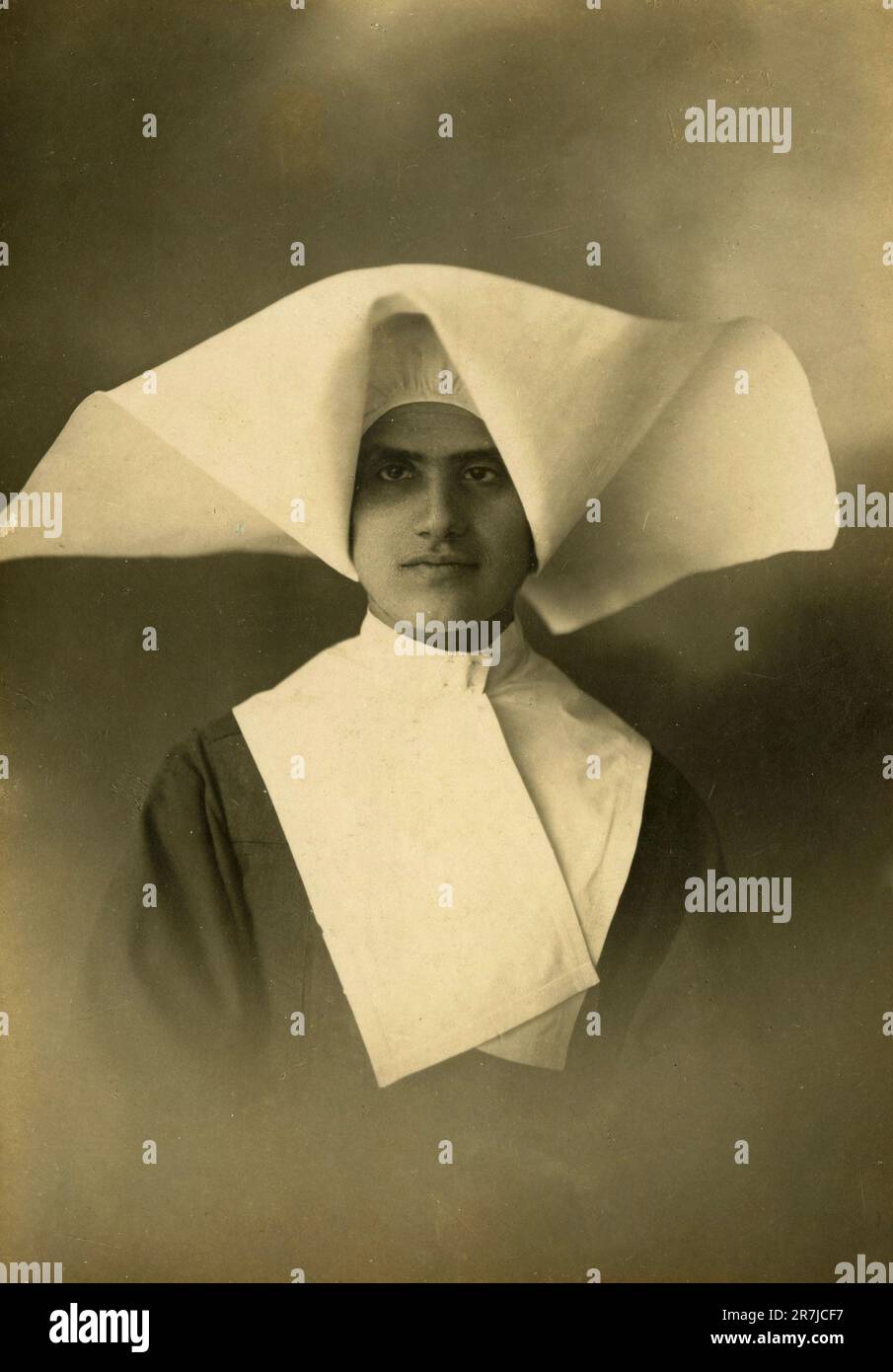 Studio portrait of a catholic nun with a large hat, Italy 1900s Stock ...
