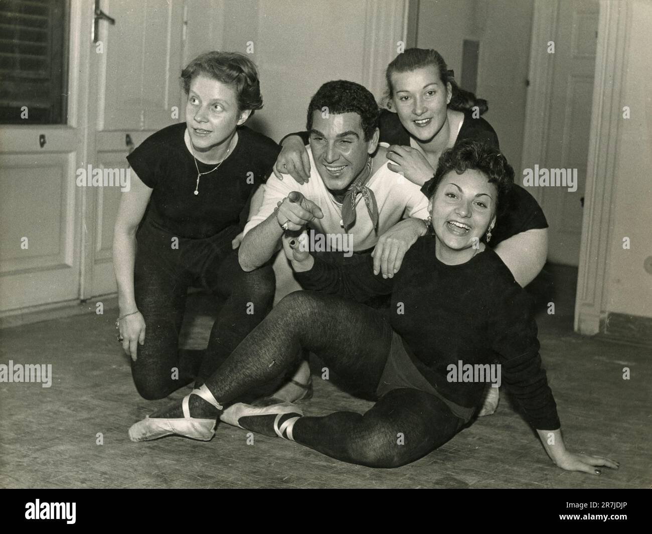 Dancer Carlos Proietti with three dancer girls around, Italy 1960s ...