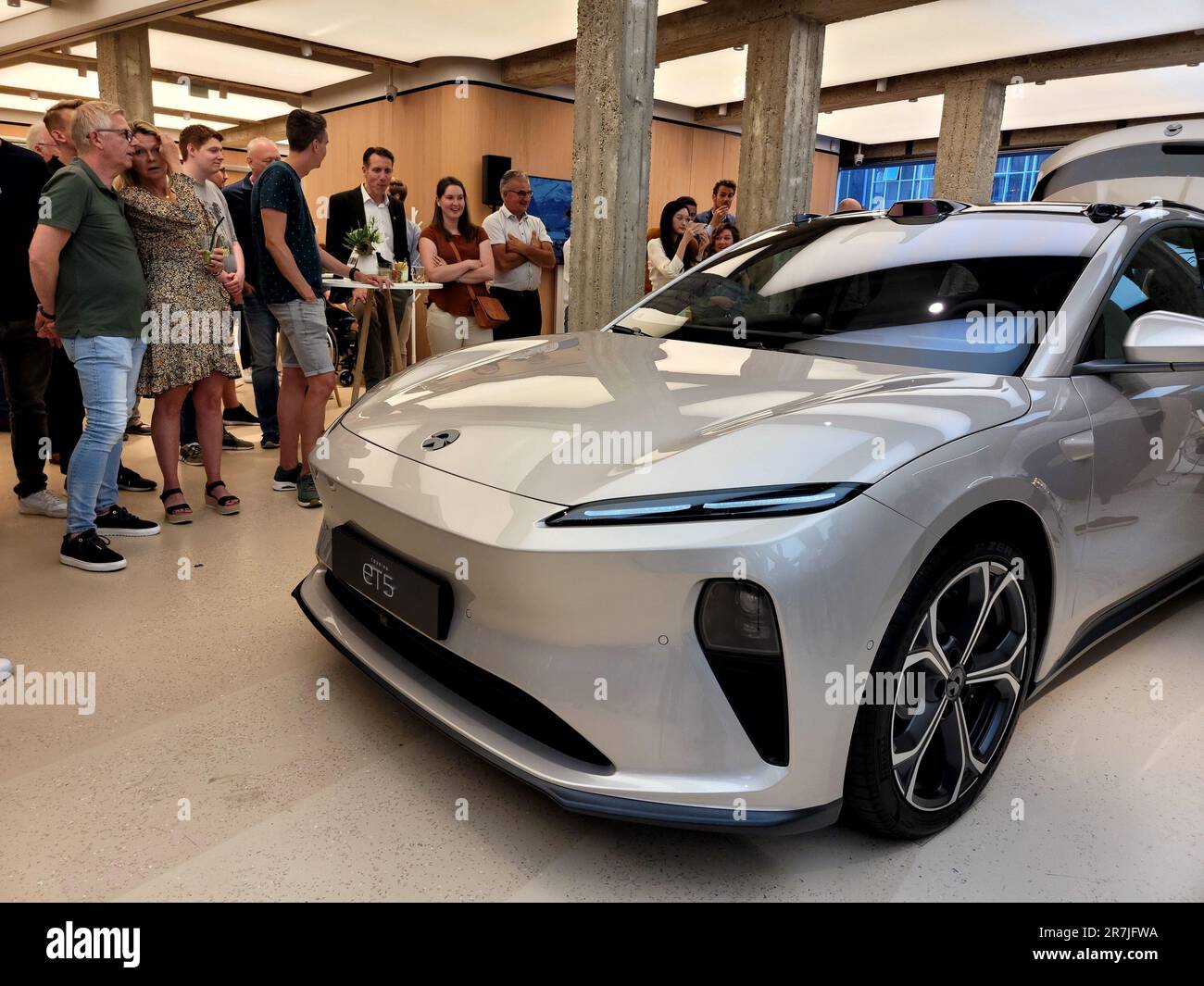 Rotterdam, Netherlands. 15th June, 2023. People look at an ET5 Touring ...