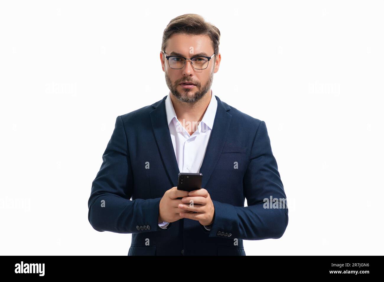 Business man in suit watching on mobile phone. Handsome man wearing ...
