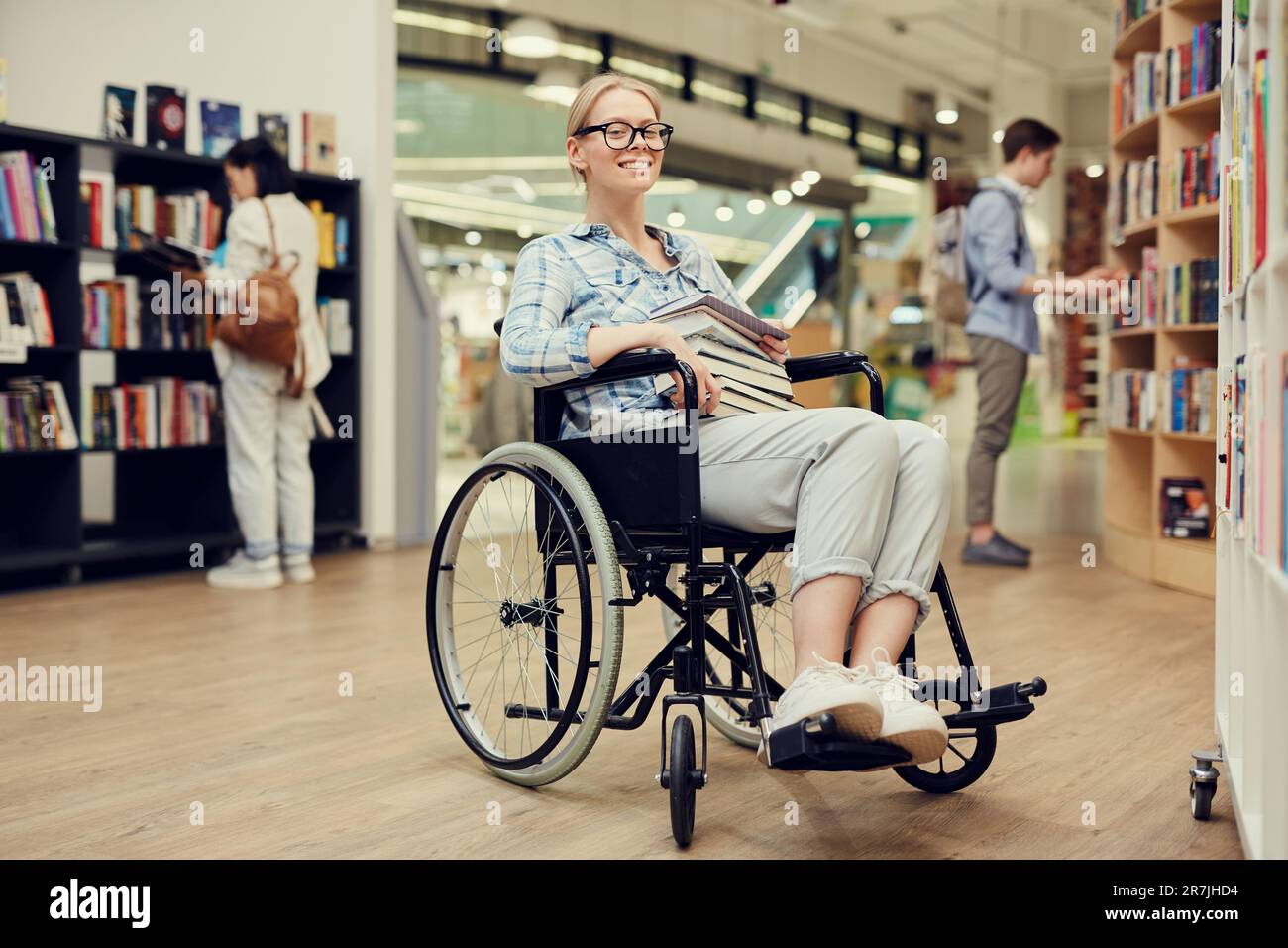 Portrait of happy smart person with disability girl with blond hair ...