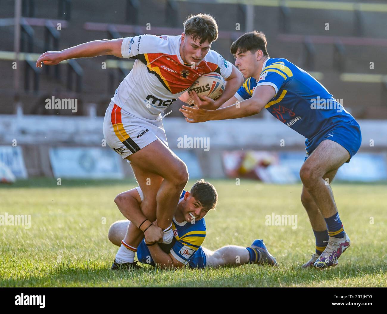 Bradford Bulls Academy's Jack Iceton (left) is tackled by Leeds Rhinos ...