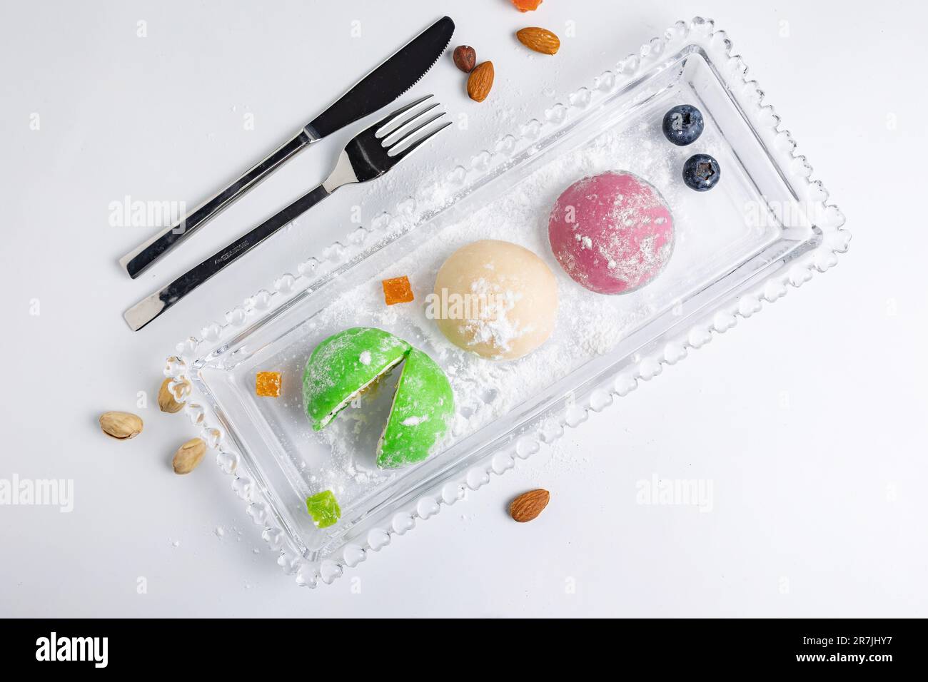 A plate of traditional Japanese mochi dessert served with nuts Stock ...