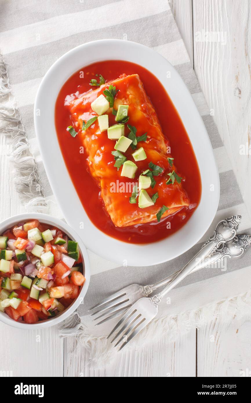 Wet Burrito stuffed with shredded meat, beans, rice and cheese ...