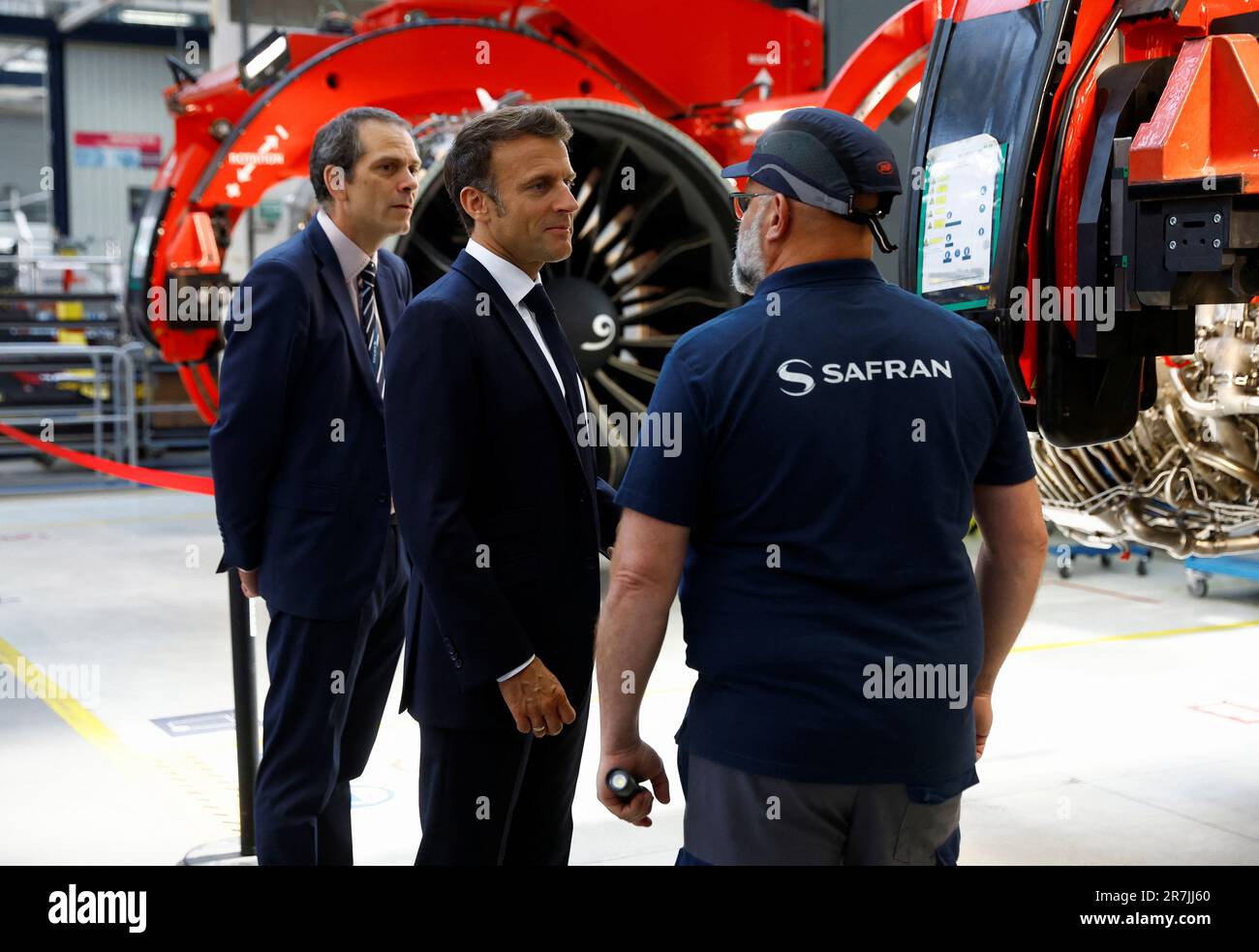 French President Emmanuel Macron, center, visits the Safran Aircraft Engines site in Villaroche ...