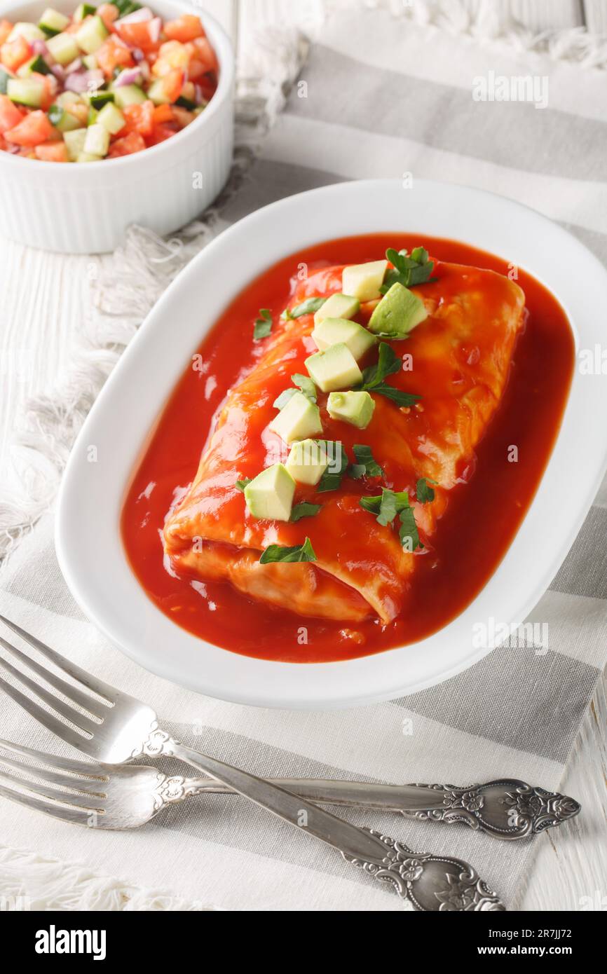 Wet Burrito stuffed with shredded meat, beans, rice and cheese ...